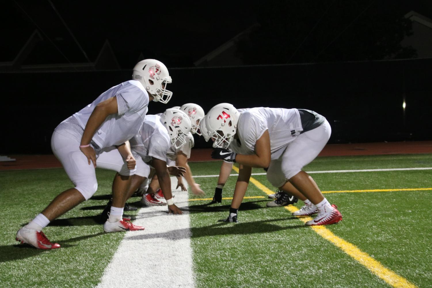 Varsity Football Night Practices – The Eagle